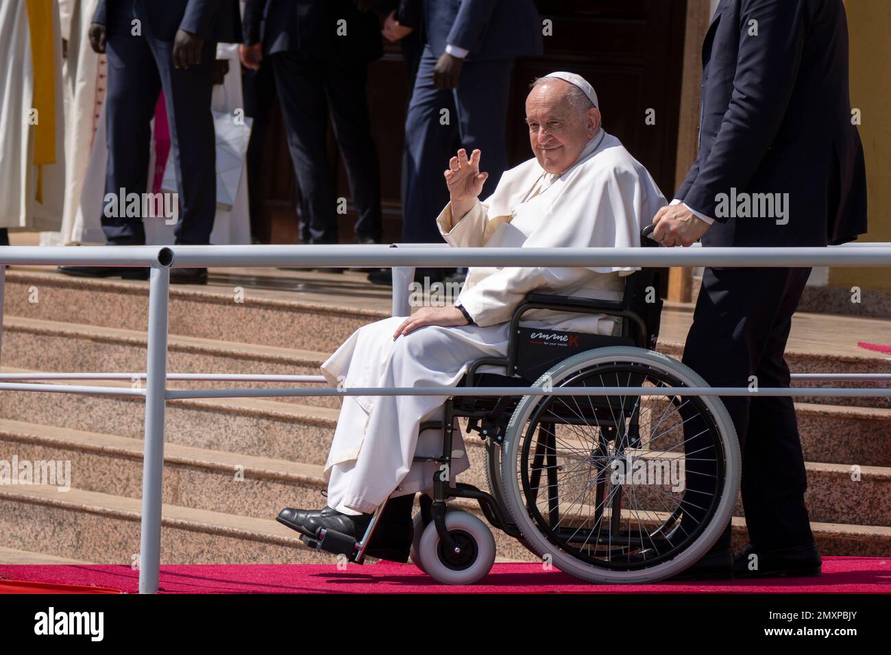 Pope Francis gestures to those gathered as he leaves after addressing ...