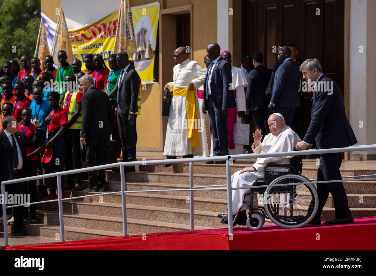 Pope Francis gestures to those gathered as he leaves after addressing ...