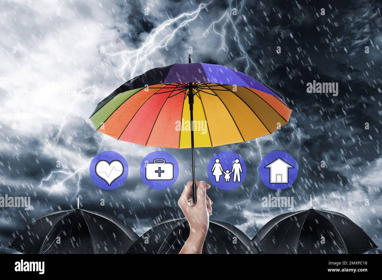 Insurance agent covering illustrations with rainbow umbrella during ...