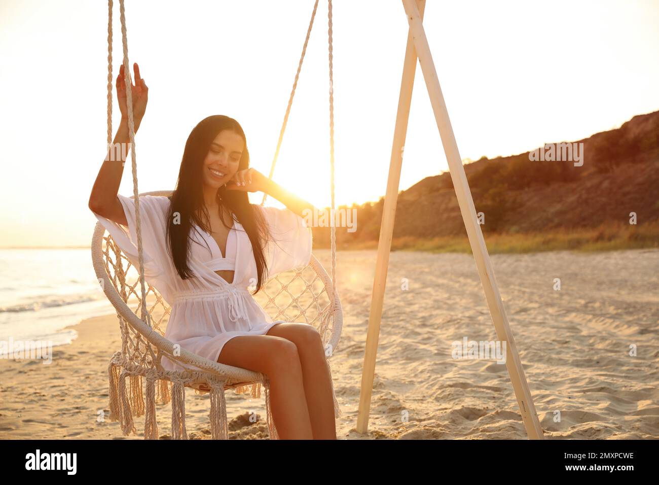 Beautiful woman on swing hi-res stock photography and images - Alamy