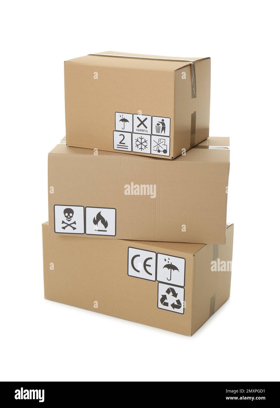 Stack of cardboard boxes with different packaging symbols on white ...