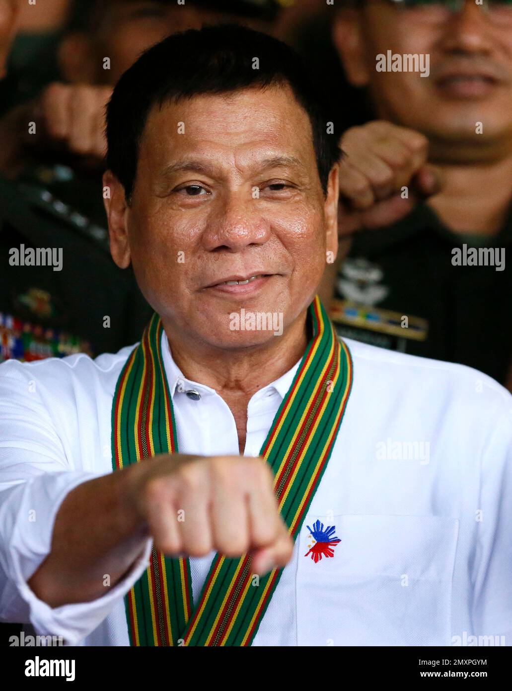 Philippine President Rodrigo Duterte gestures with a fist bump as he ...