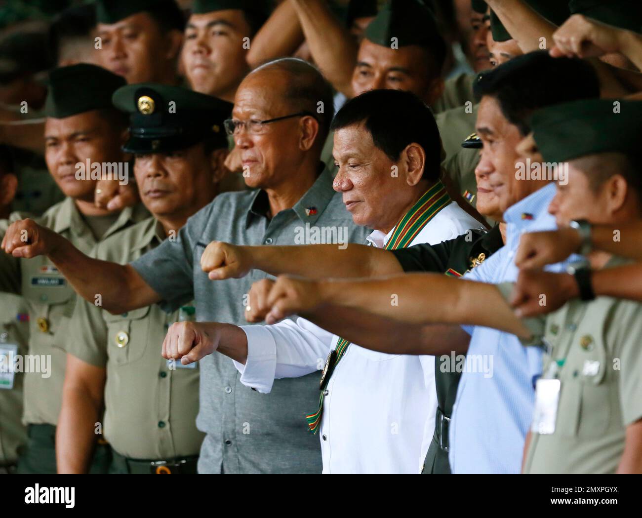 Philippine President Rodrigo Duterte, fourth from left, gestures with a ...