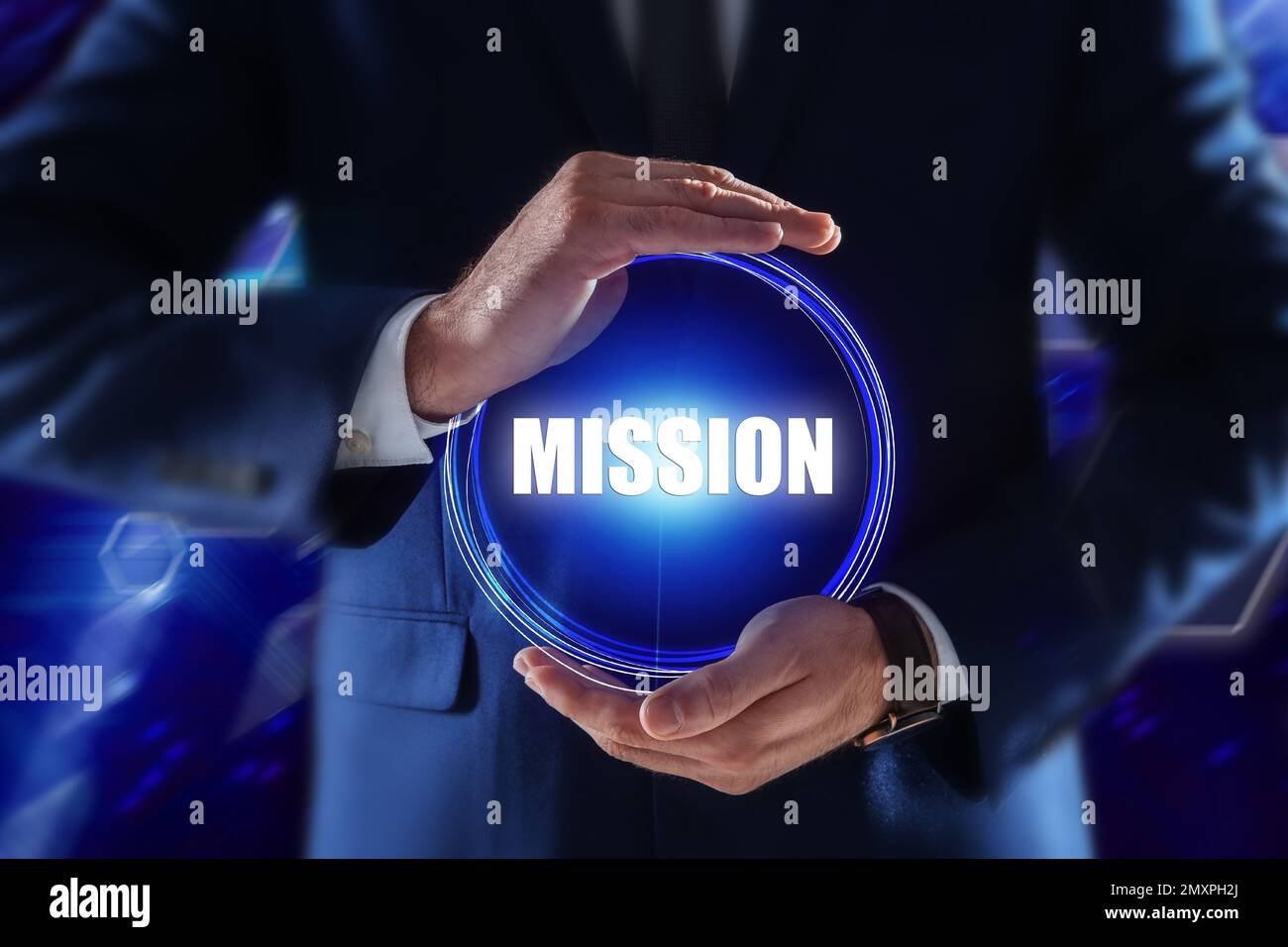 Mission concept. Businessman demonstrating word on blurred background ...