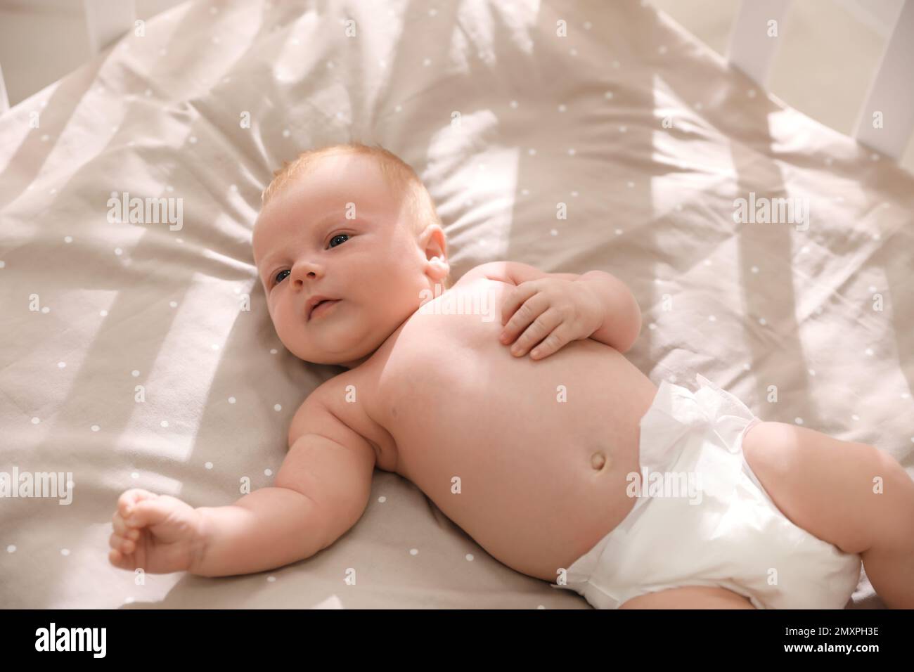 Cute healthy baby lying in cot, view from above Stock Photo - Alamy