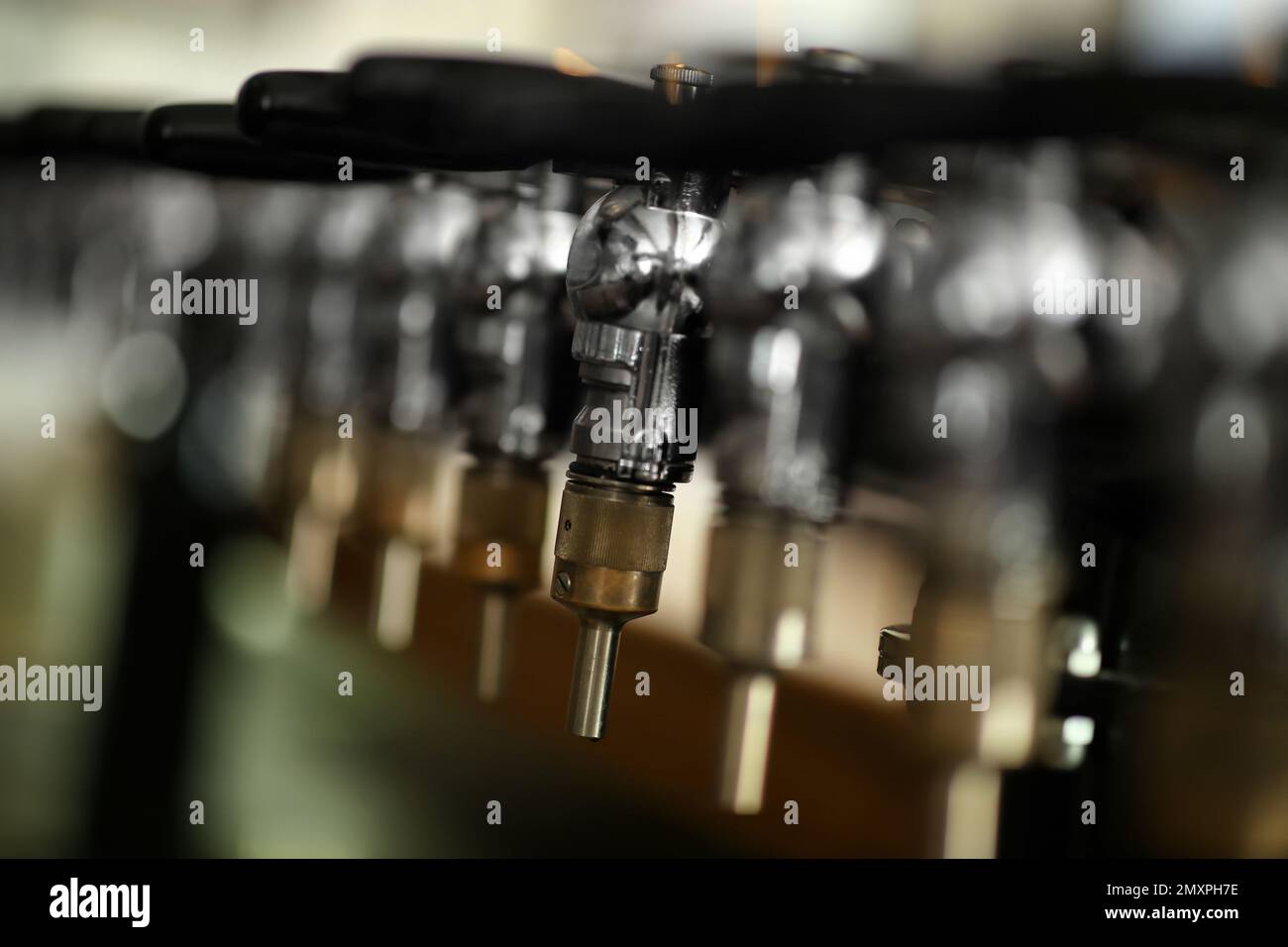 New modern beer taps in pub, closeup. Professional bar equipment Stock ...