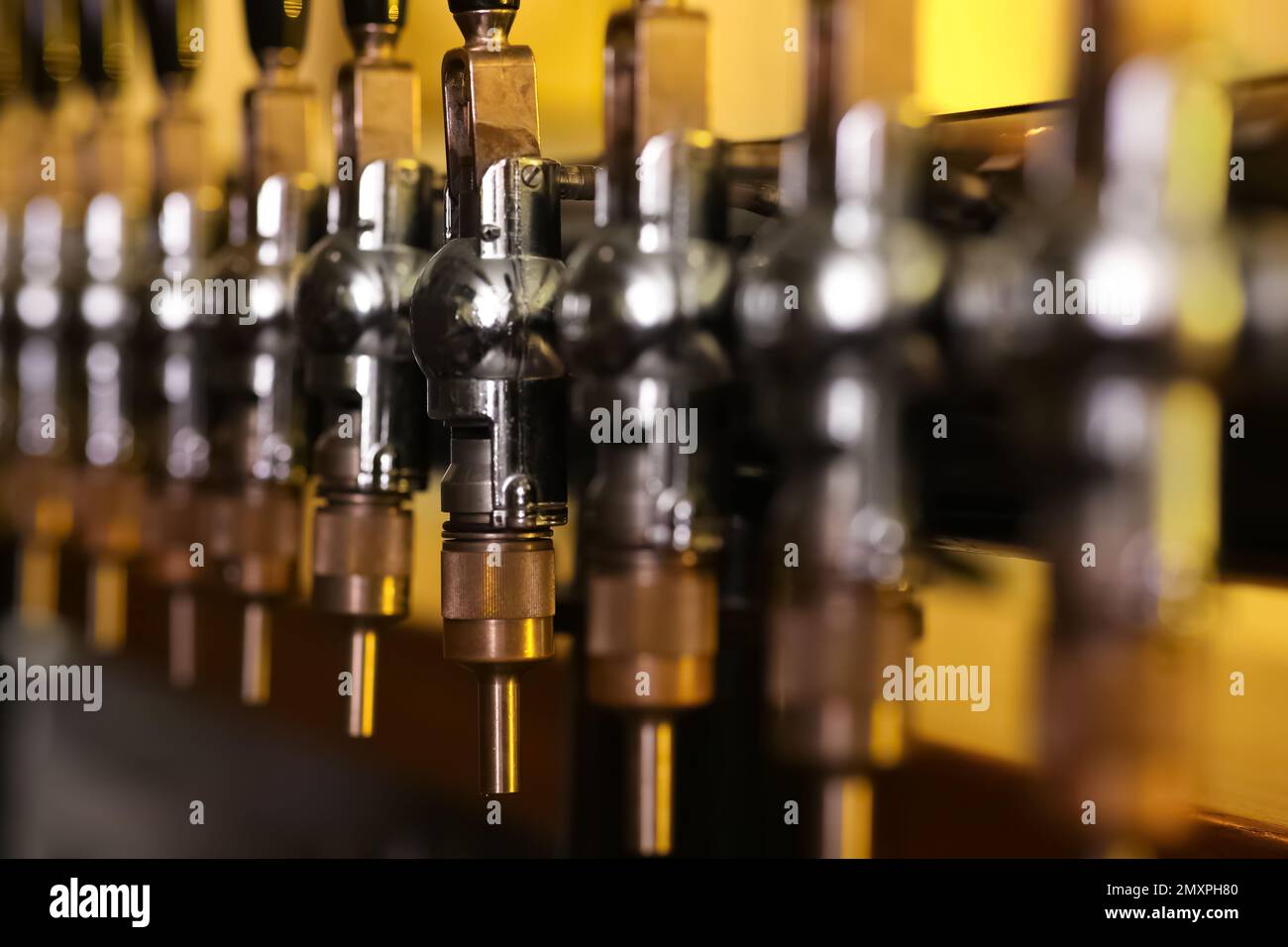 New modern beer taps in pub, closeup. Professional bar equipment Stock ...
