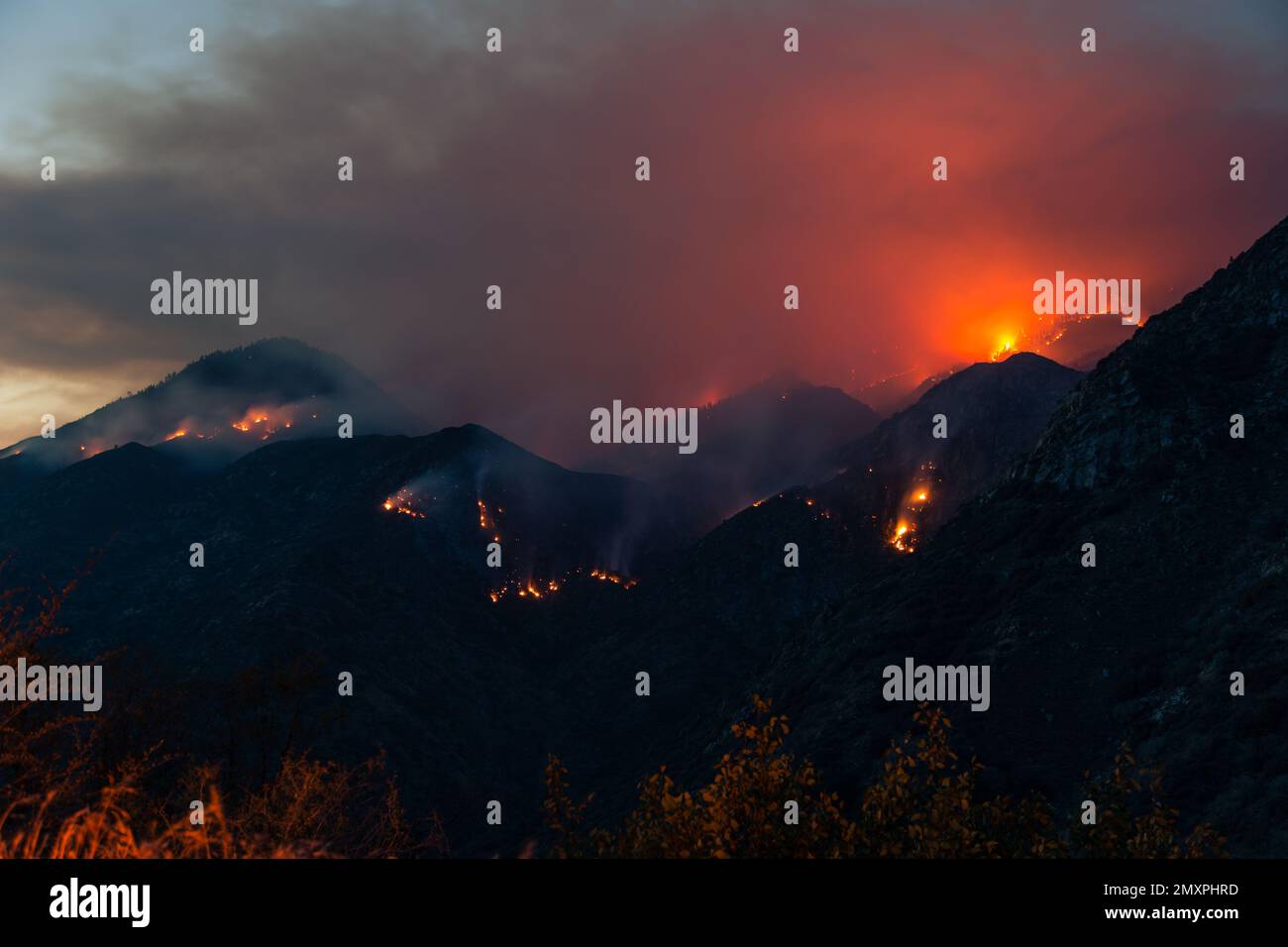 An aerial view of beautiful mountains burning in the fire Stock Photo ...
