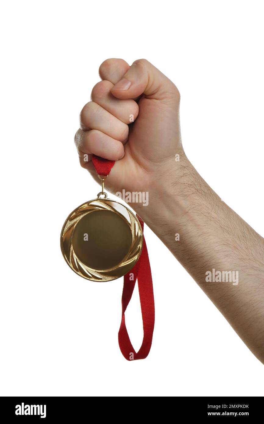 Man holding golden medal on white background, closeup. Space for design ...