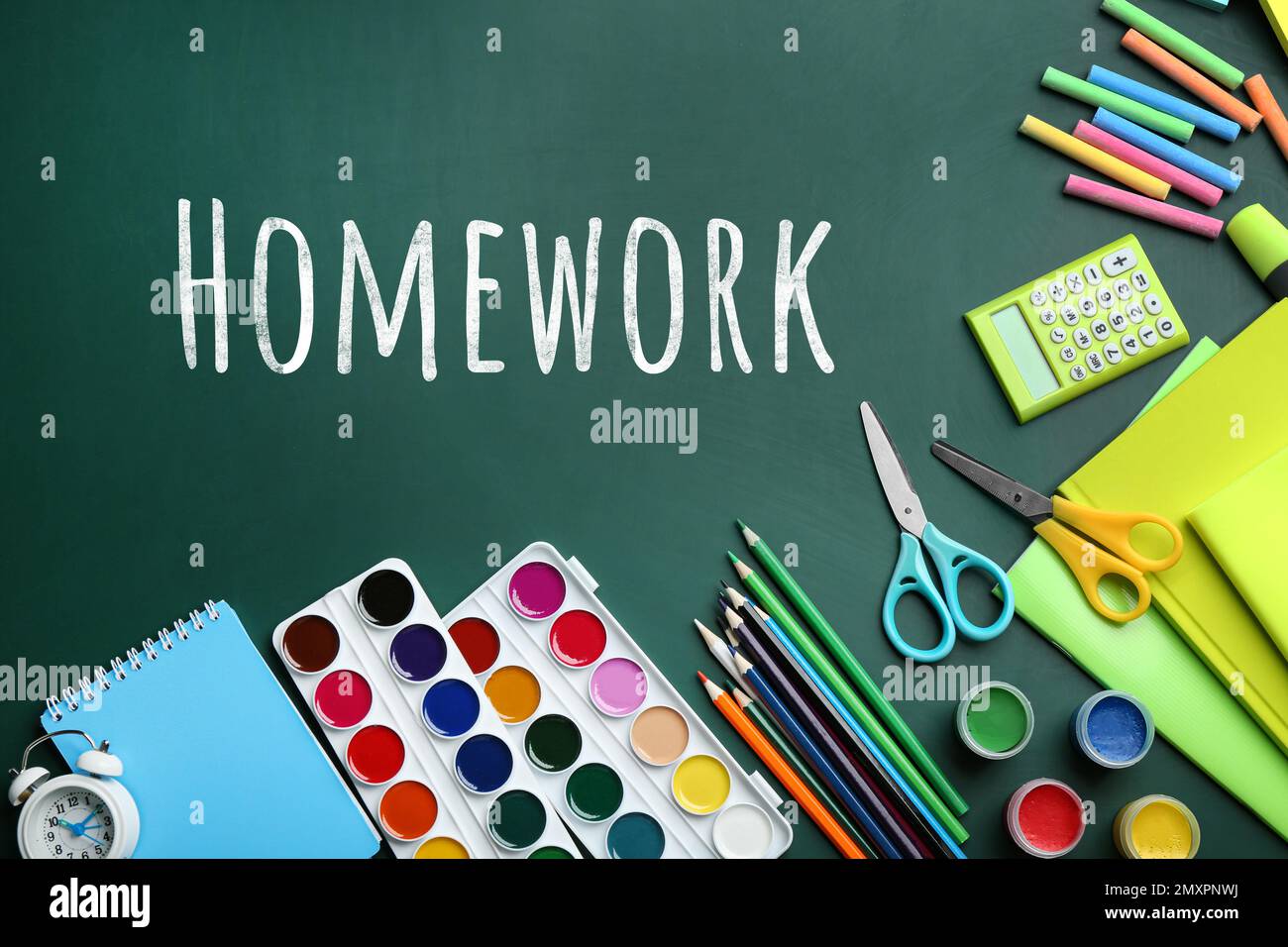 Flat lay composition with school supplies and inscription HOMEWORK on ...
