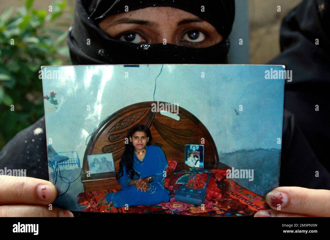 FILE - In this Oct. 27, 2008 file photo, a Pakistani mother holds a ...