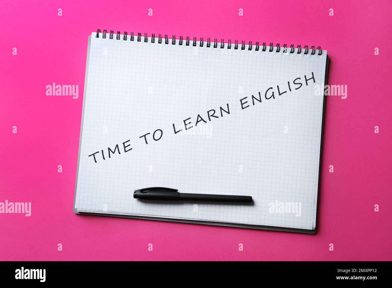 Open notebook with text Time To Learn English and pen on pink ...