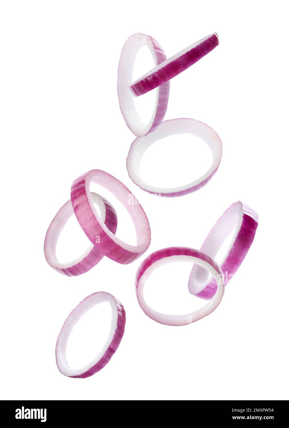 Red onion slices falling on white background Stock Photo - Alamy