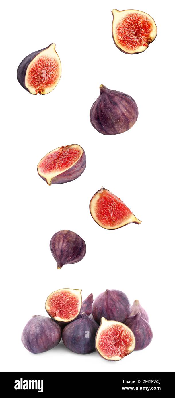 Cut and whole figs falling on white background Stock Photo - Alamy