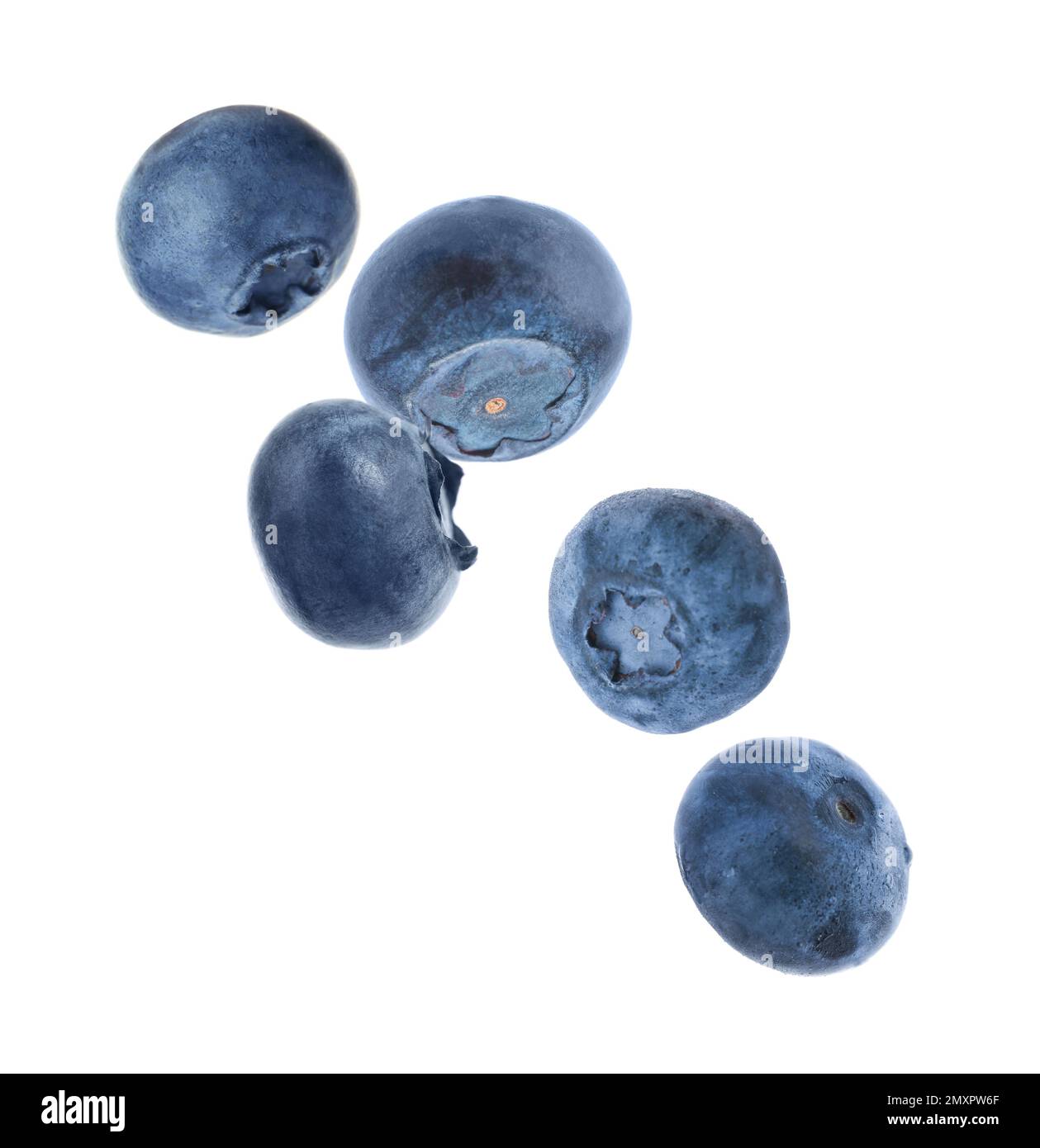 Many fresh ripe blueberries falling on white background Stock Photo - Alamy