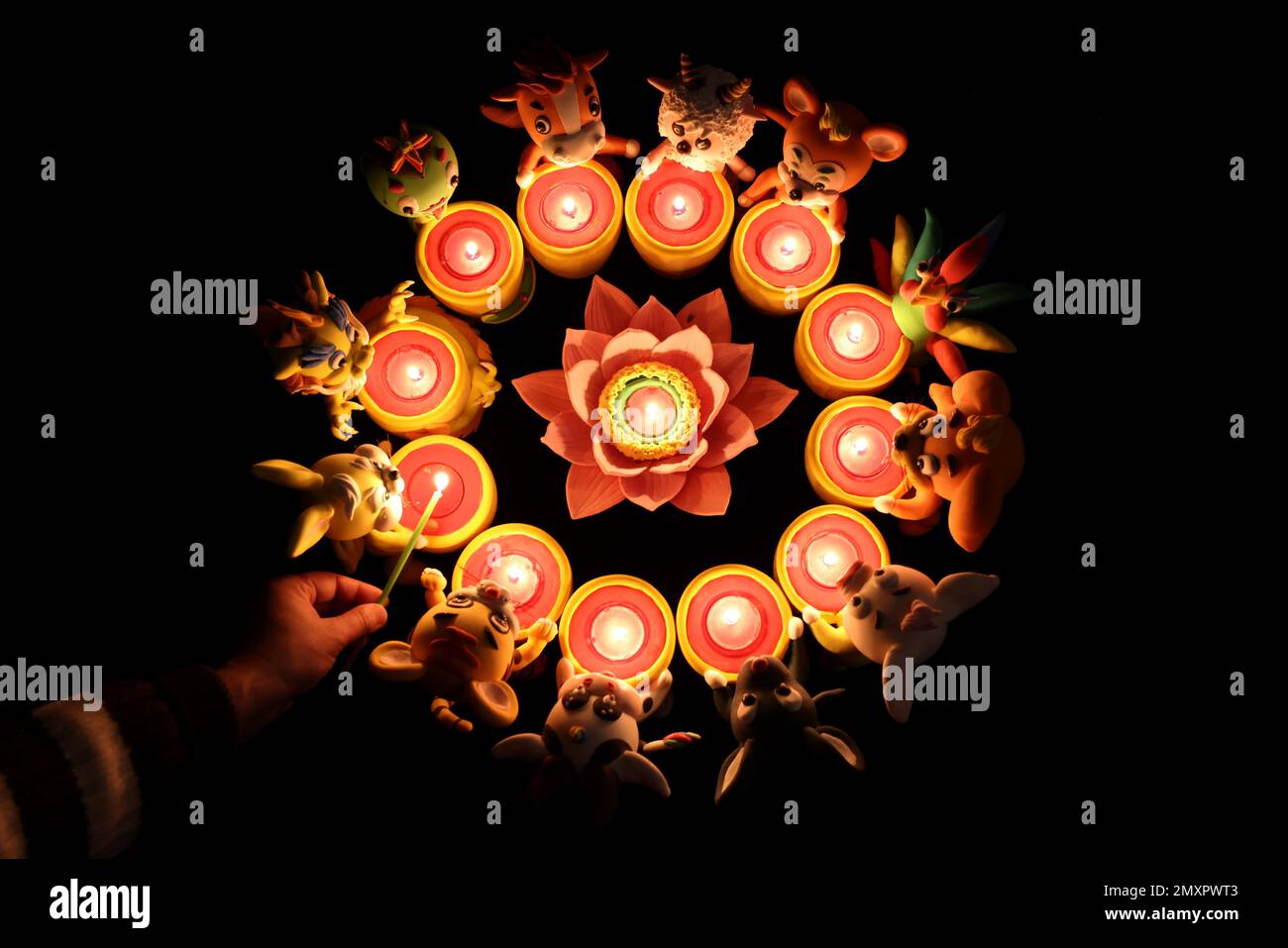 ZAOZHUANG, CHINA - FEBRUARY 4, 2023 - Folk artist Zhang Ting lights up ...