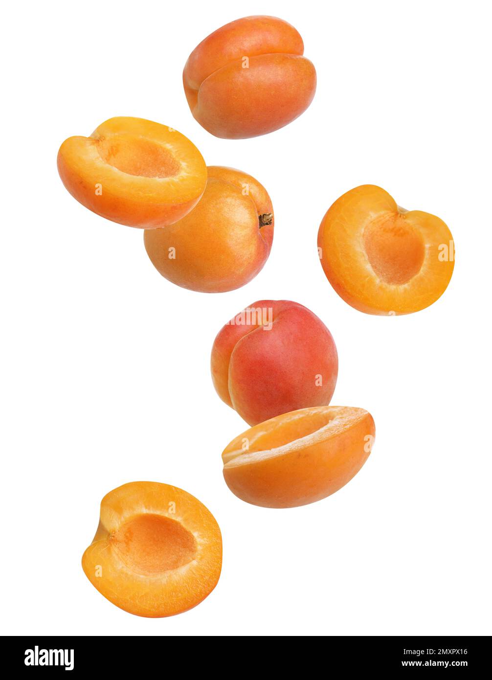 Cut and whole ripe apricots falling on white background Stock Photo - Alamy
