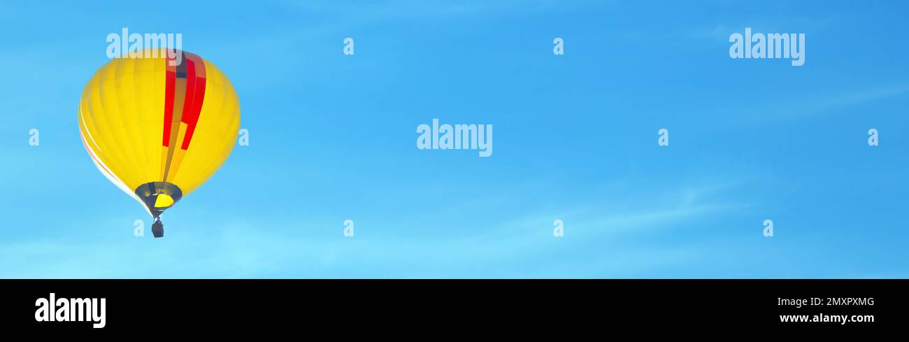 Hot air balloon in blue sky, space for text. Banner design Stock Photo ...