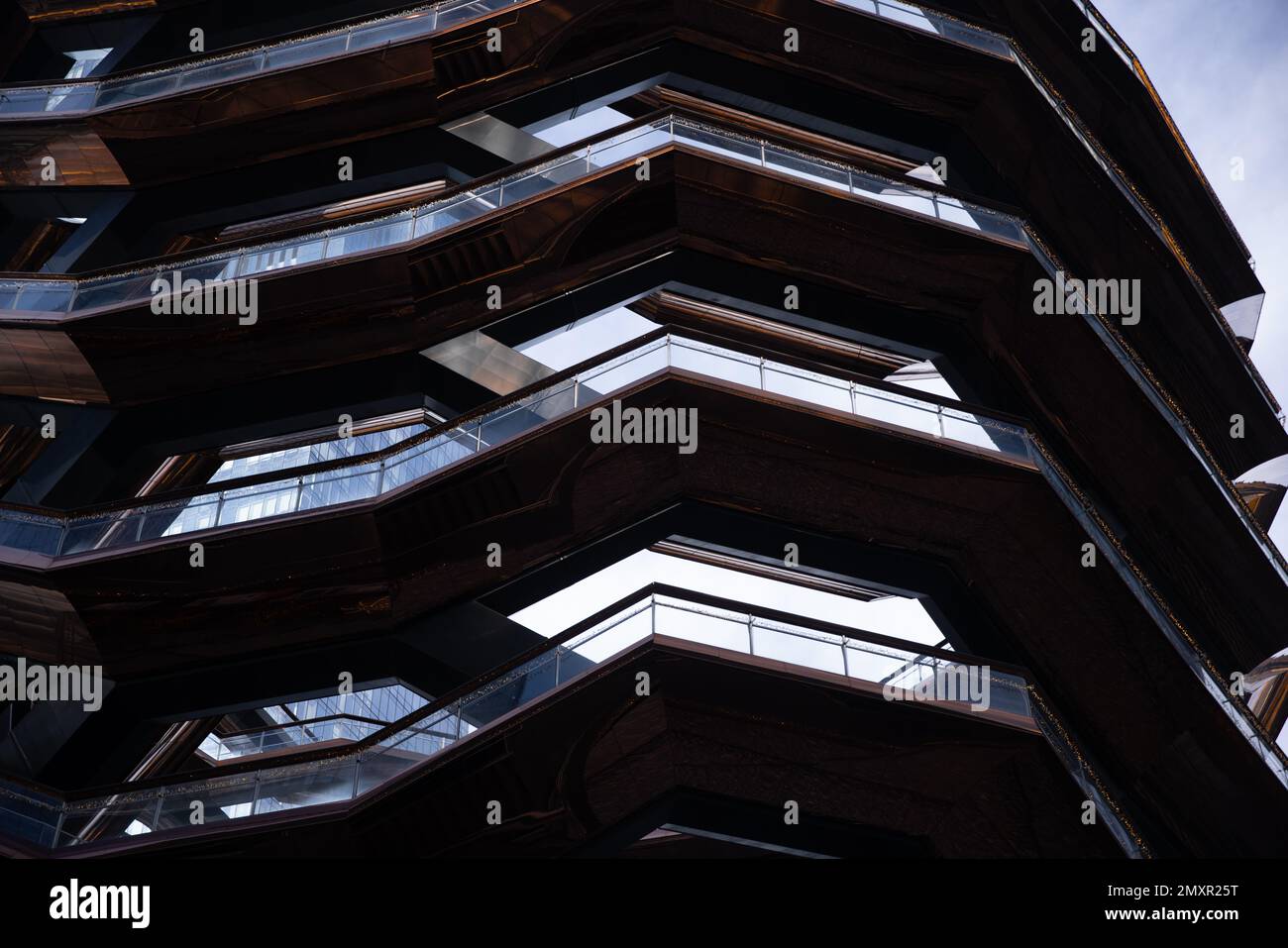 A low angle shot of the exterior of the modern Vessel building in New ...