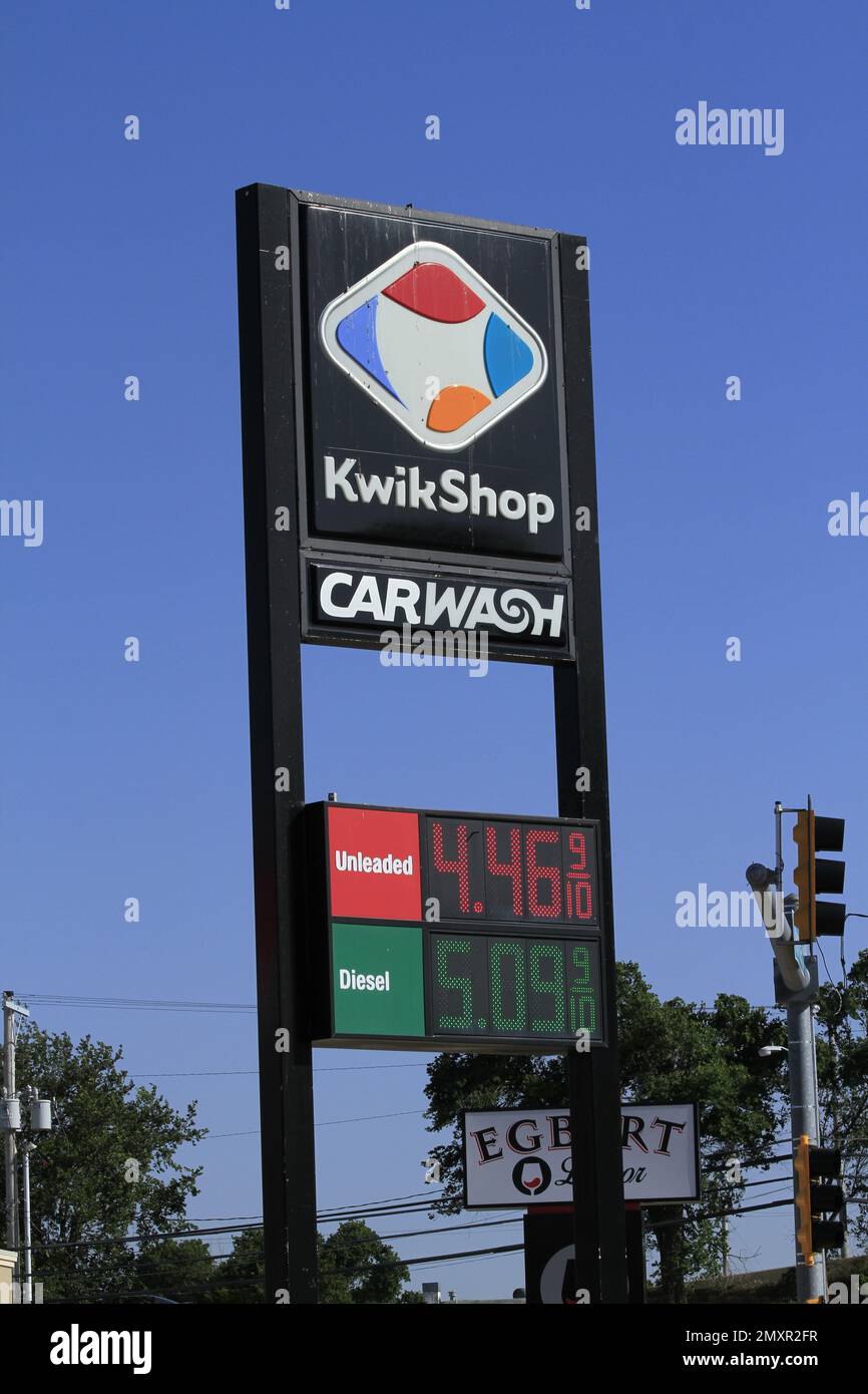Kwik Shop advertisement sign with blue sky Stock Photo - Alamy