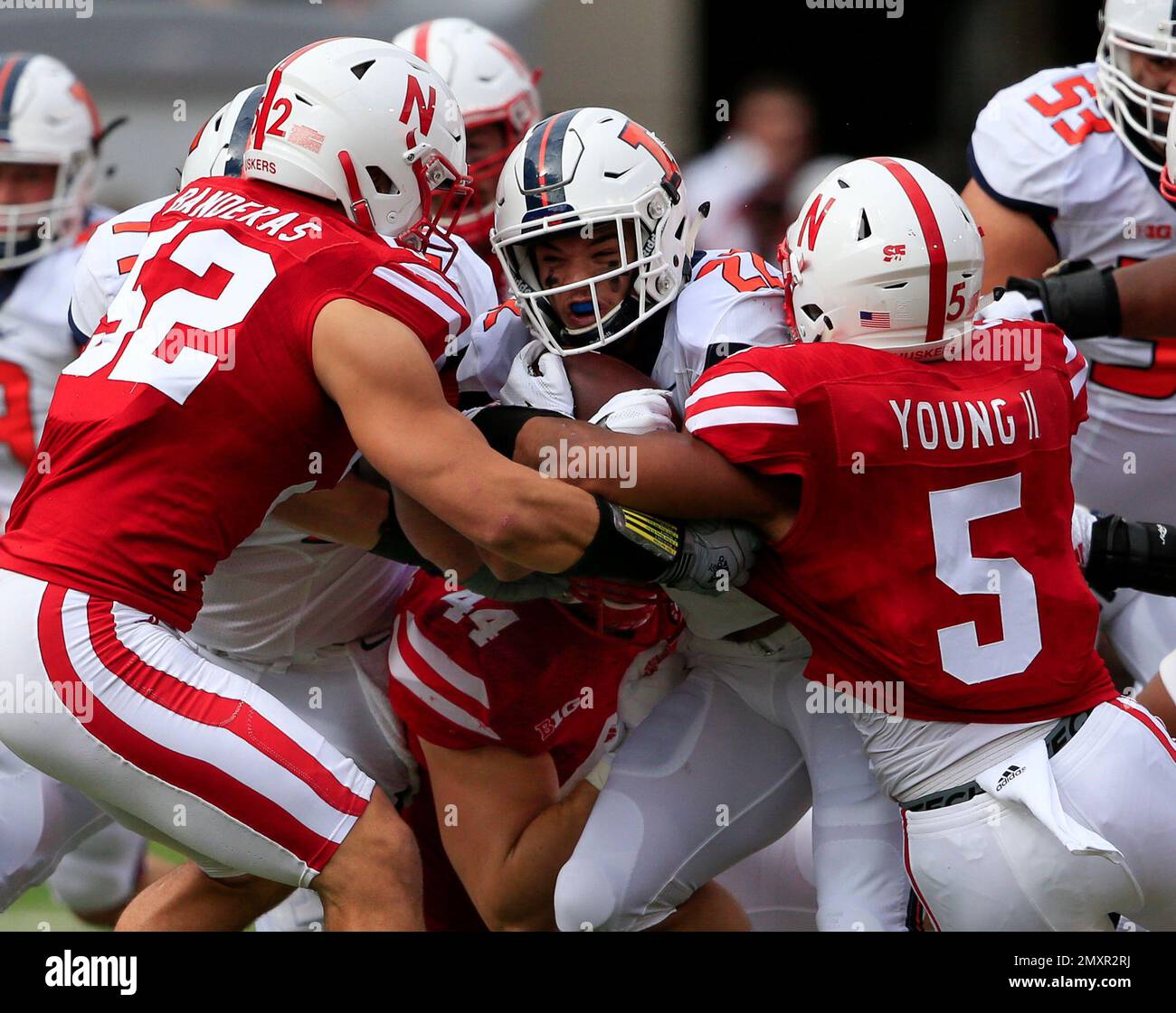 Illinois running back Kendrick Foster (22) is tackled by Nebraska ...