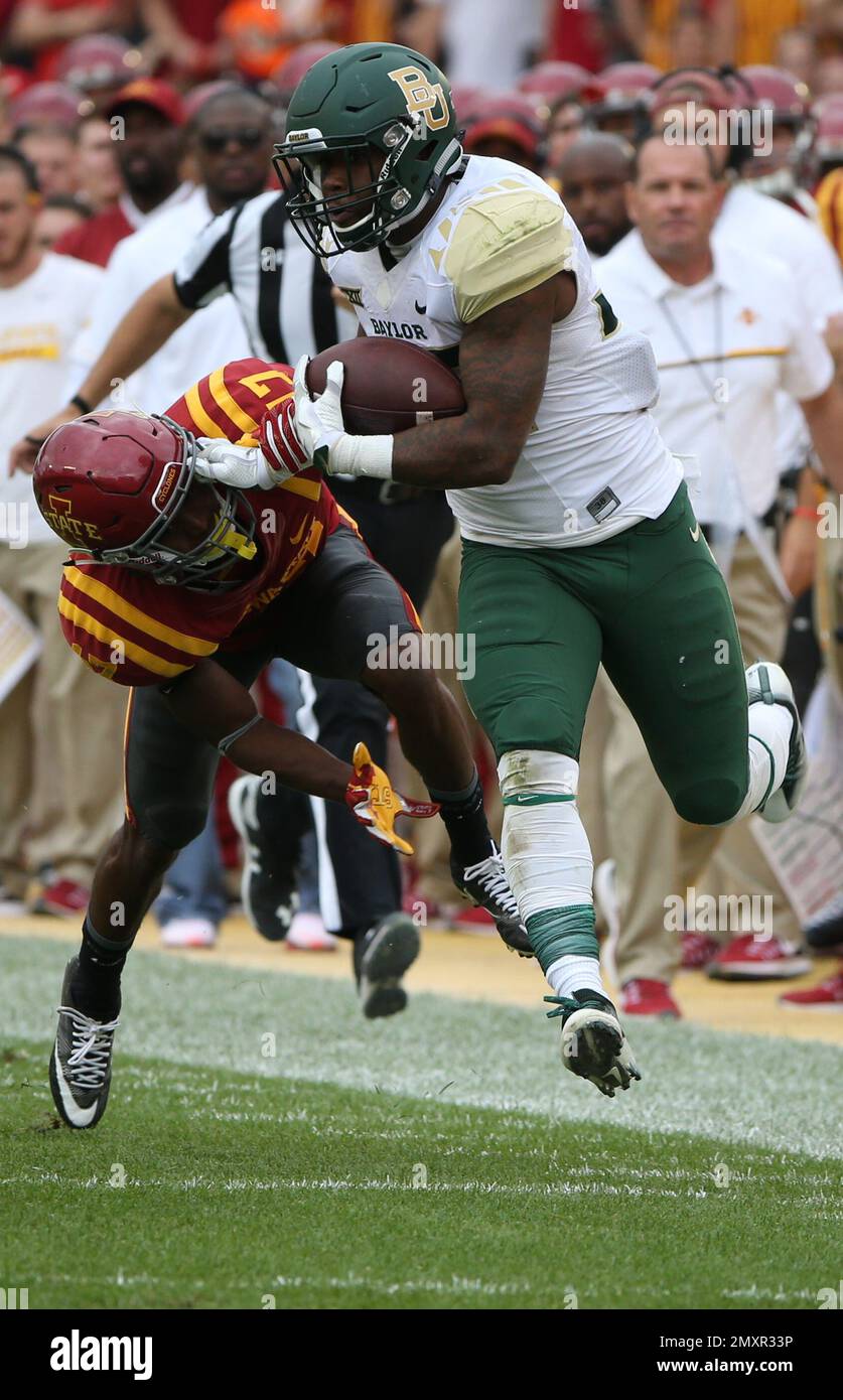 Baylor running back Shock Linwood stiff arms Iowa State defensive back ...