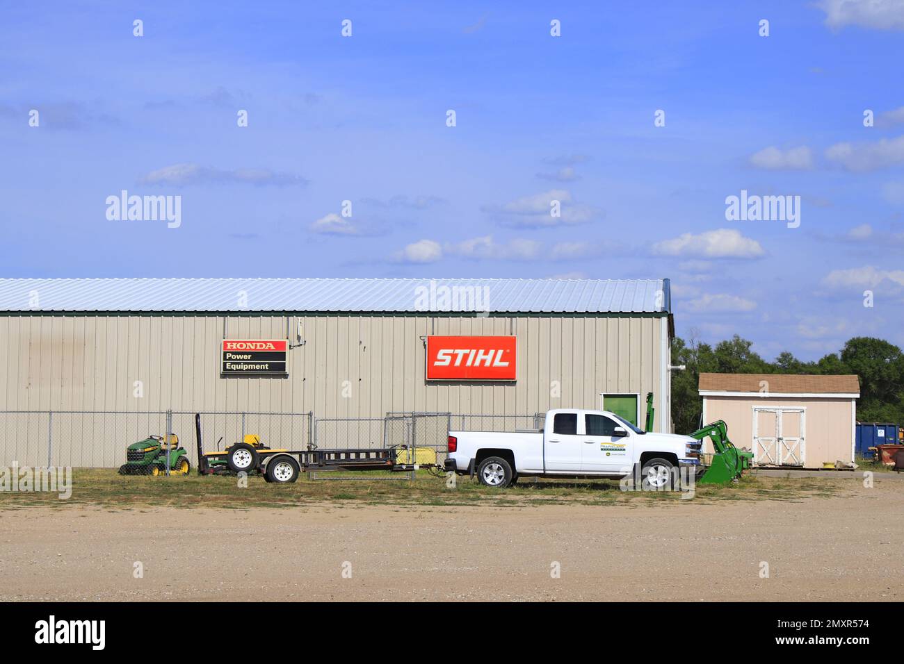 Metal Building with STIHL and HONDA Power Equipment signs on the side ...