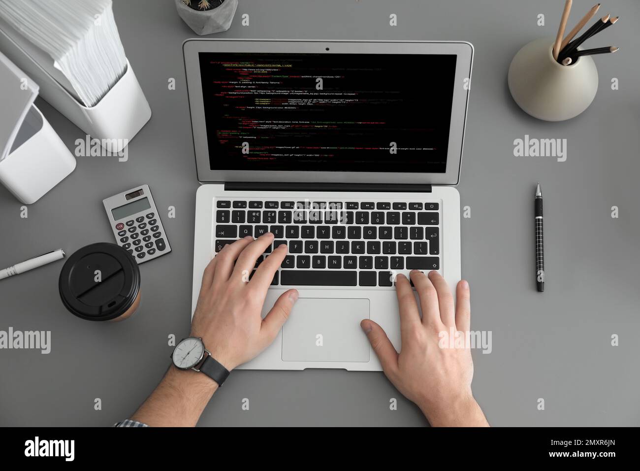 Professional programmer working with laptop at table, top view Stock ...