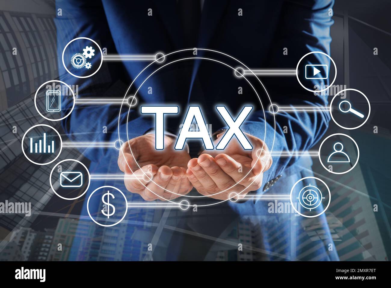 Tax concept. Man demonstrating scheme with icons Stock Photo - Alamy