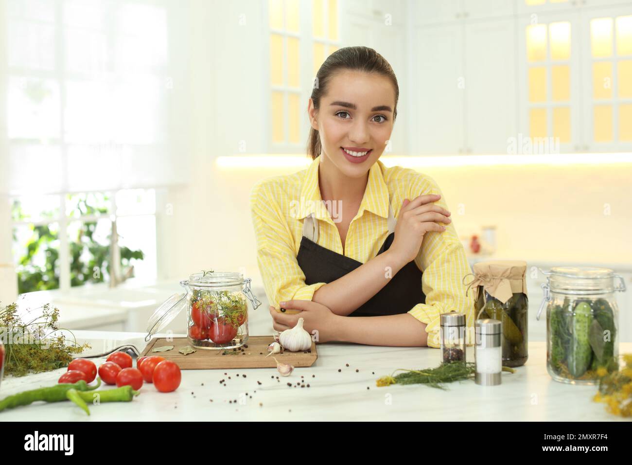 Woman pickling vegetables table hi-res stock photography and images - Alamy