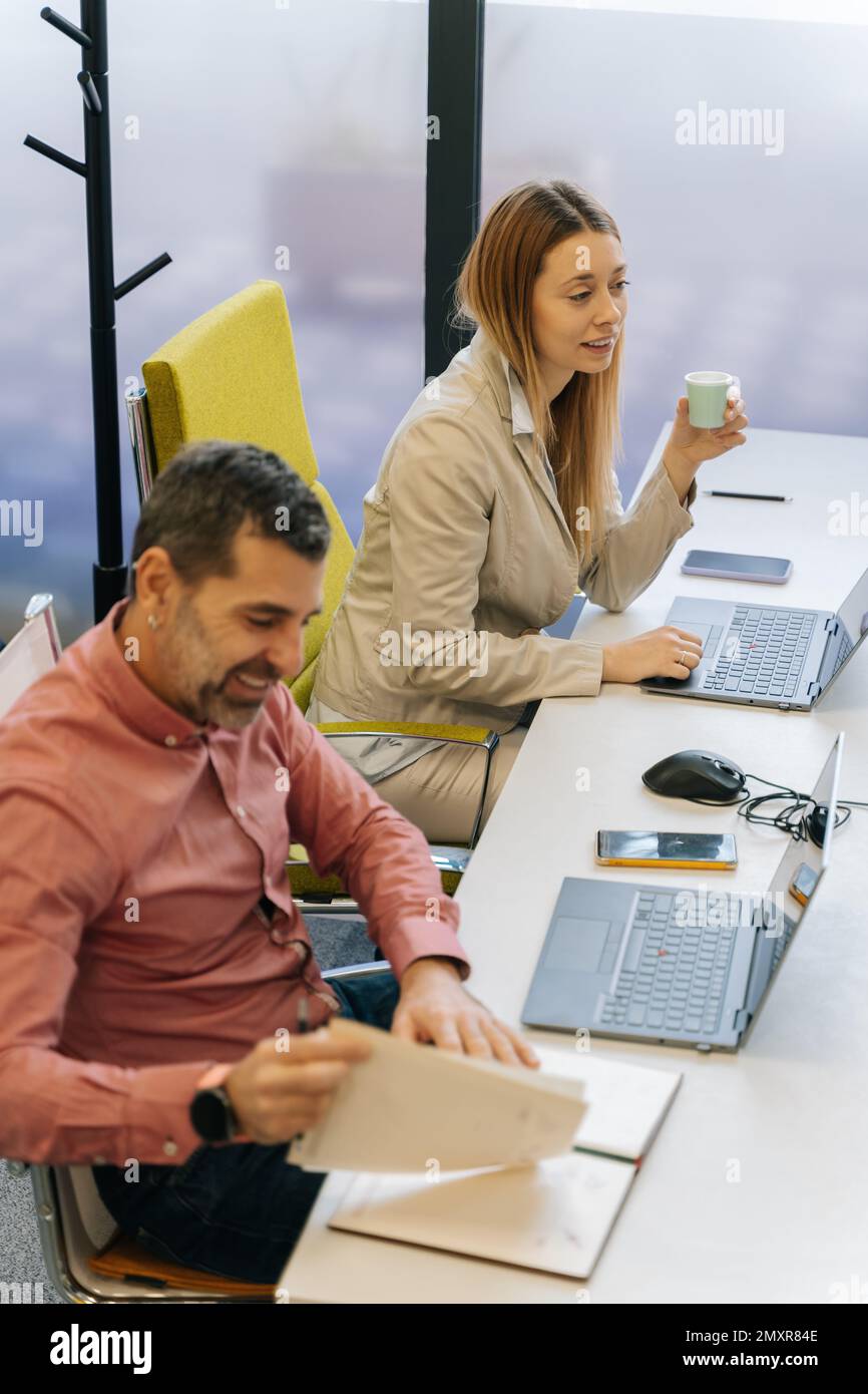 A beautiful conversation between two coworkers and their boss Stock ...