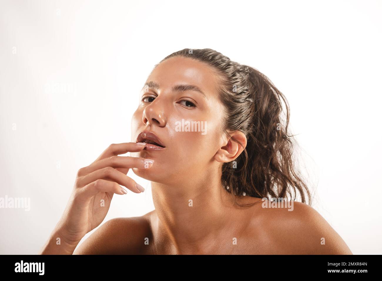 Woman touching lip cream hi-res stock photography and images - Alamy