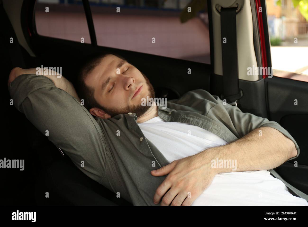 Tired man sleeping in his modern car Stock Photo - Alamy