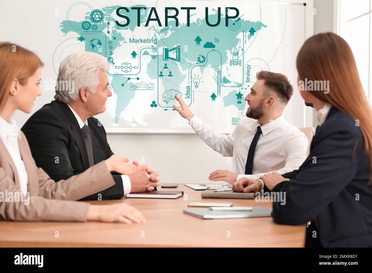Business trainer giving lecture in conference room Stock Photo - Alamy