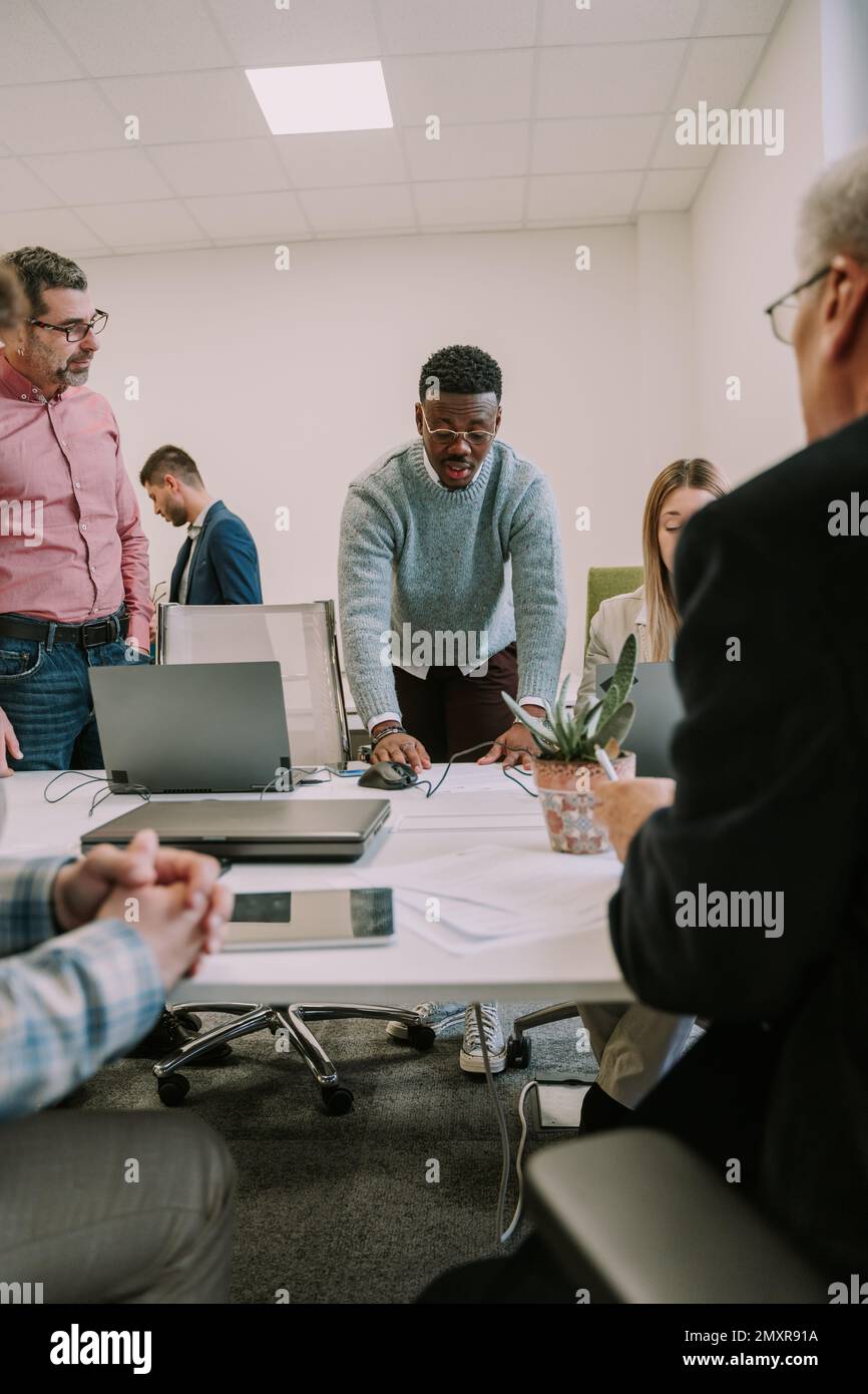 Work employee trying to get everyone’s attention and show them ...