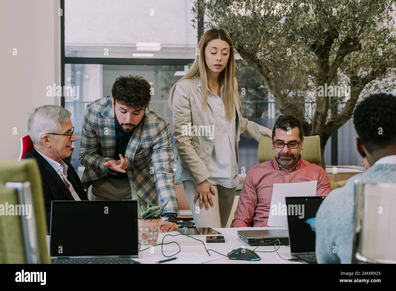 Two partners discussing the papers together about the upcoming project ...