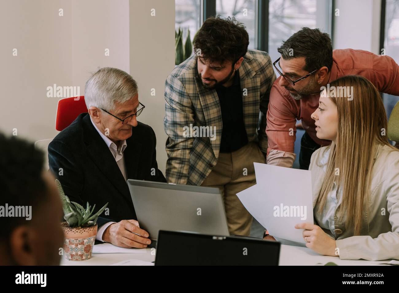 People working together in the office early in the morning Stock Photo ...