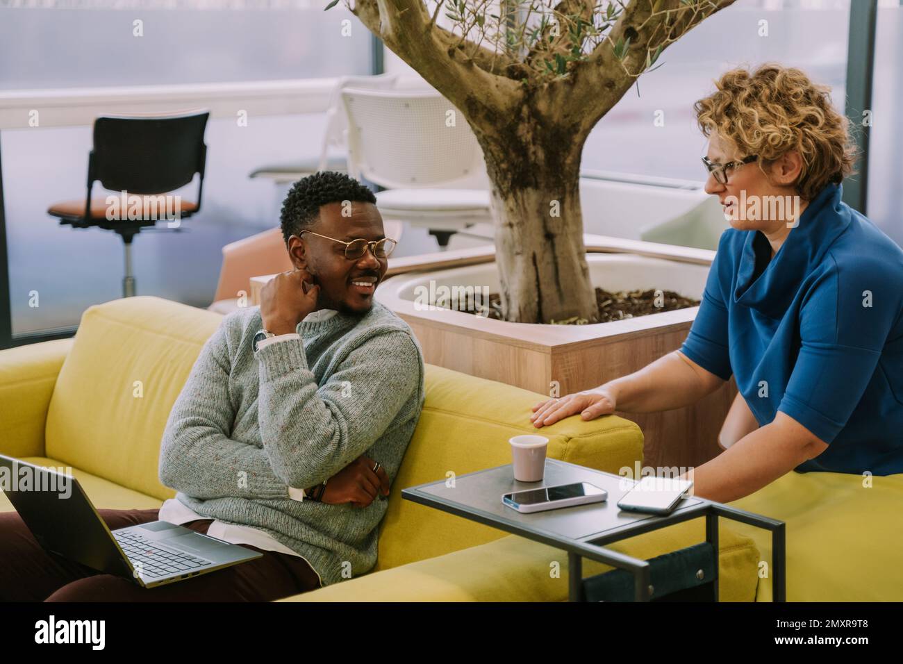 A fun conversation between two coworkers in the office, one male and ...