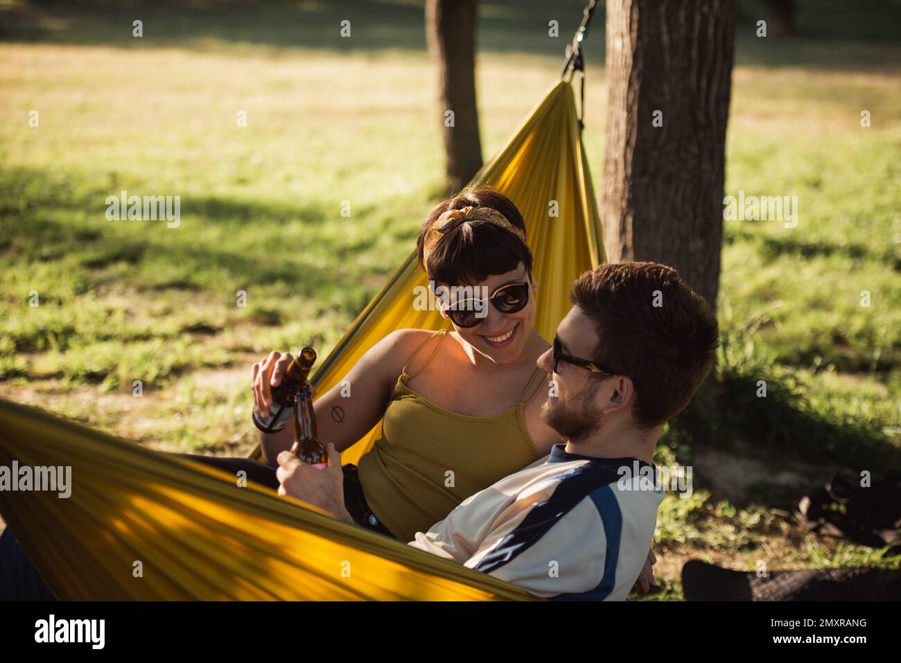 Sitting in yellow hammock cute hi-res stock photography and images - Alamy