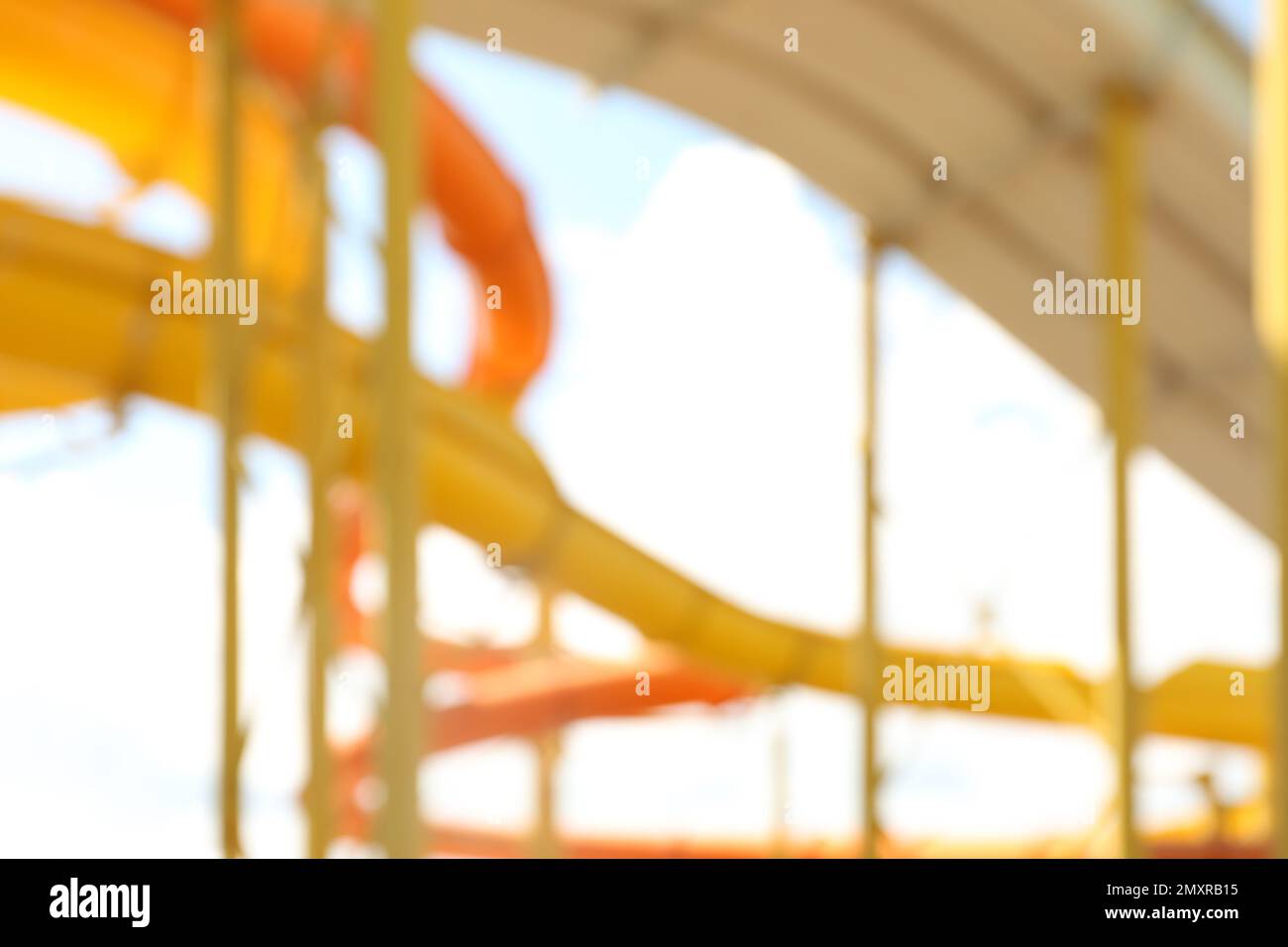 Different colorful slides in water park, blurred view Stock Photo - Alamy