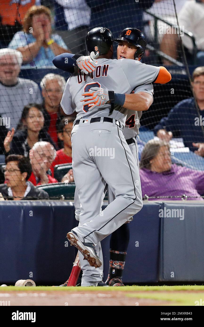 Detroit Tigers' Justin Upton (8) hugs James McCann, right, after ...
