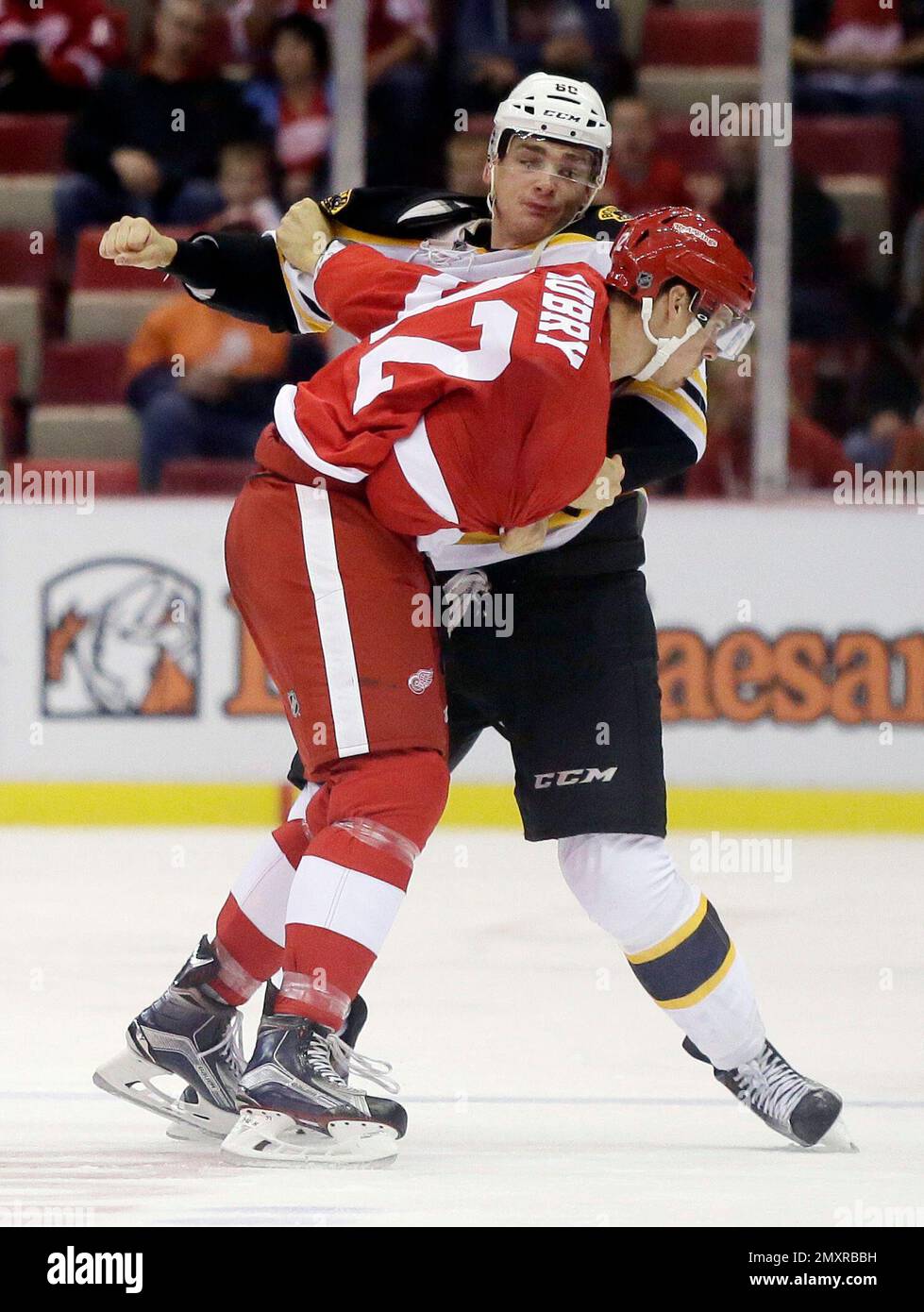 Boston Bruins' Justin Hickman fights with Detroit Red Wings' Louis-Marc ...