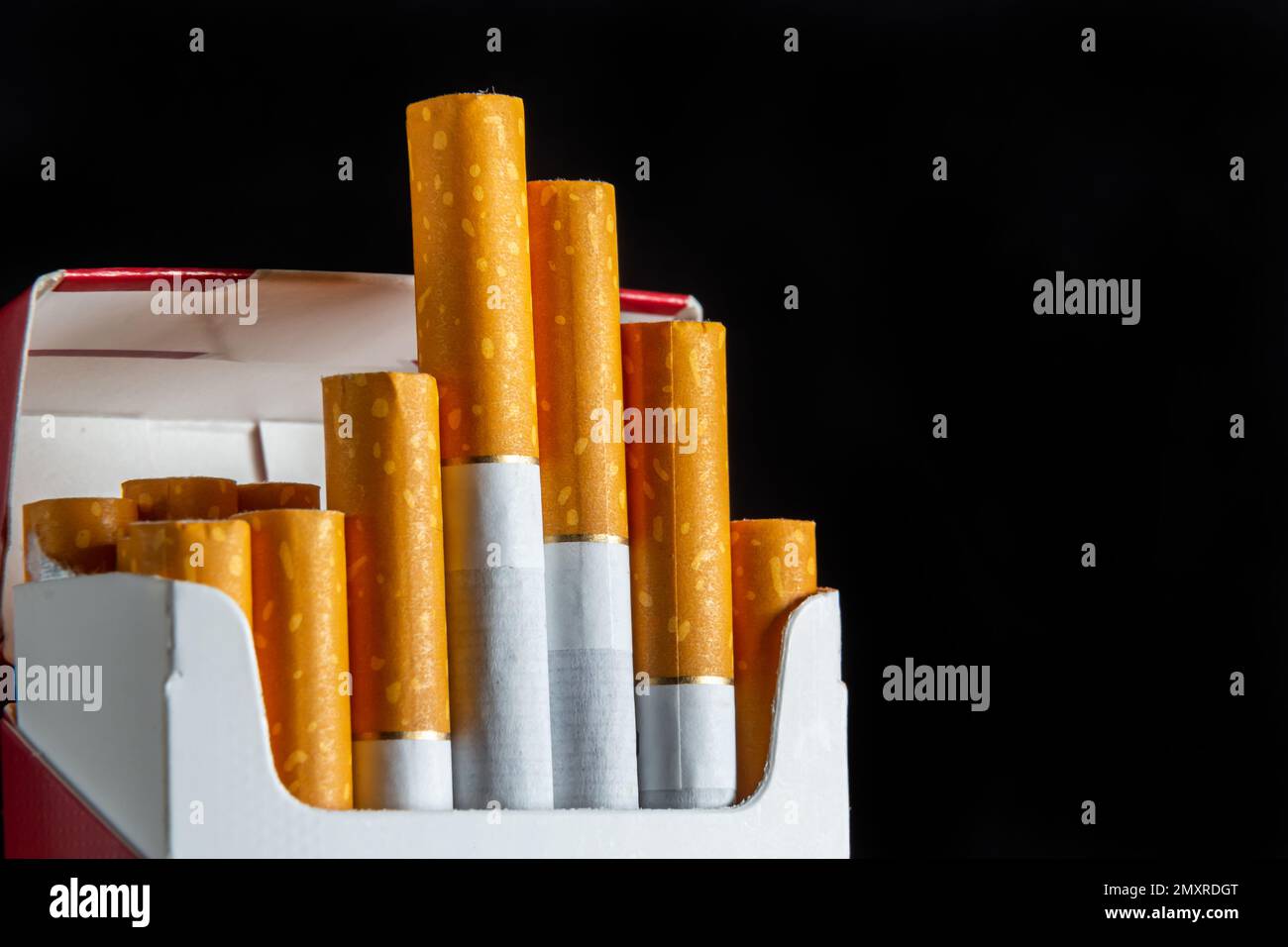Close up cigarette in pack is addictive to be cancer.smoking reduction ...