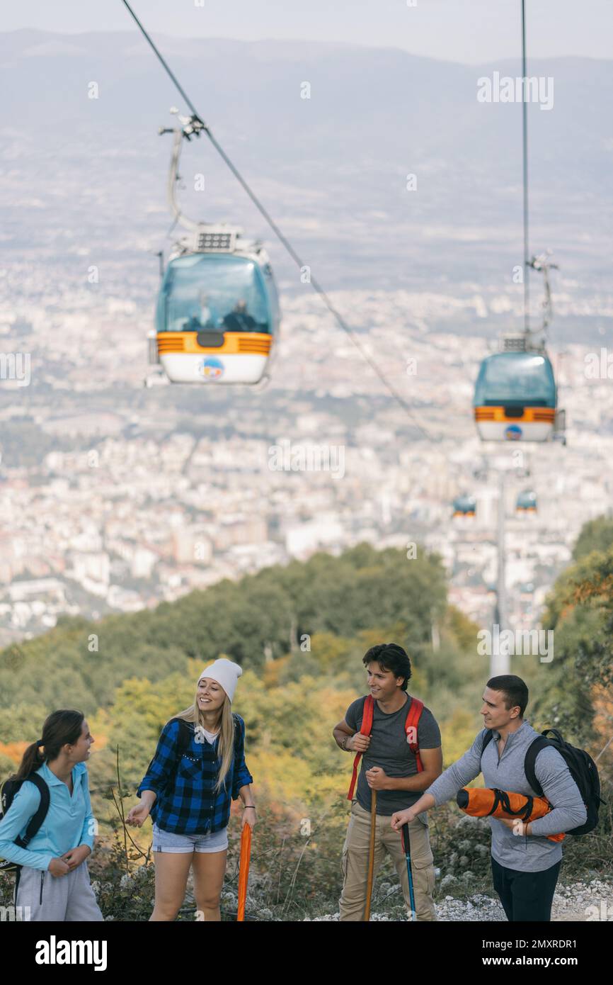 A photo of two beautiful couples standing and having a conversation ...
