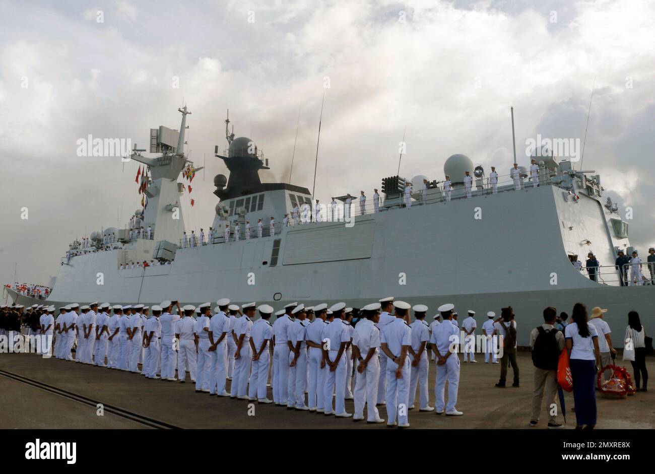Myanmar navy officers stand to welcome the arrival of a Chinese navy ...