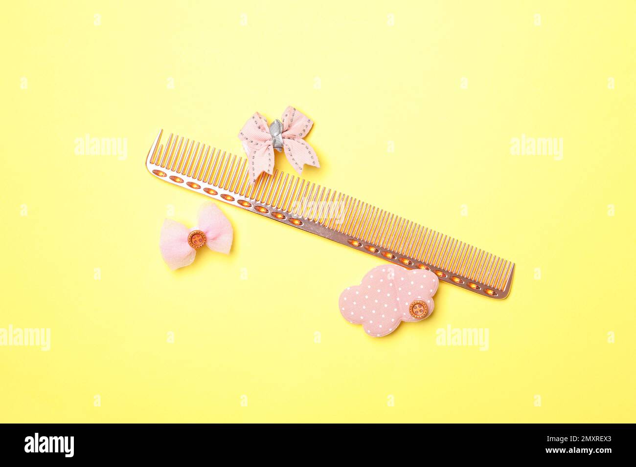 Flat lay composition with modern hair comb on yellow background Stock ...