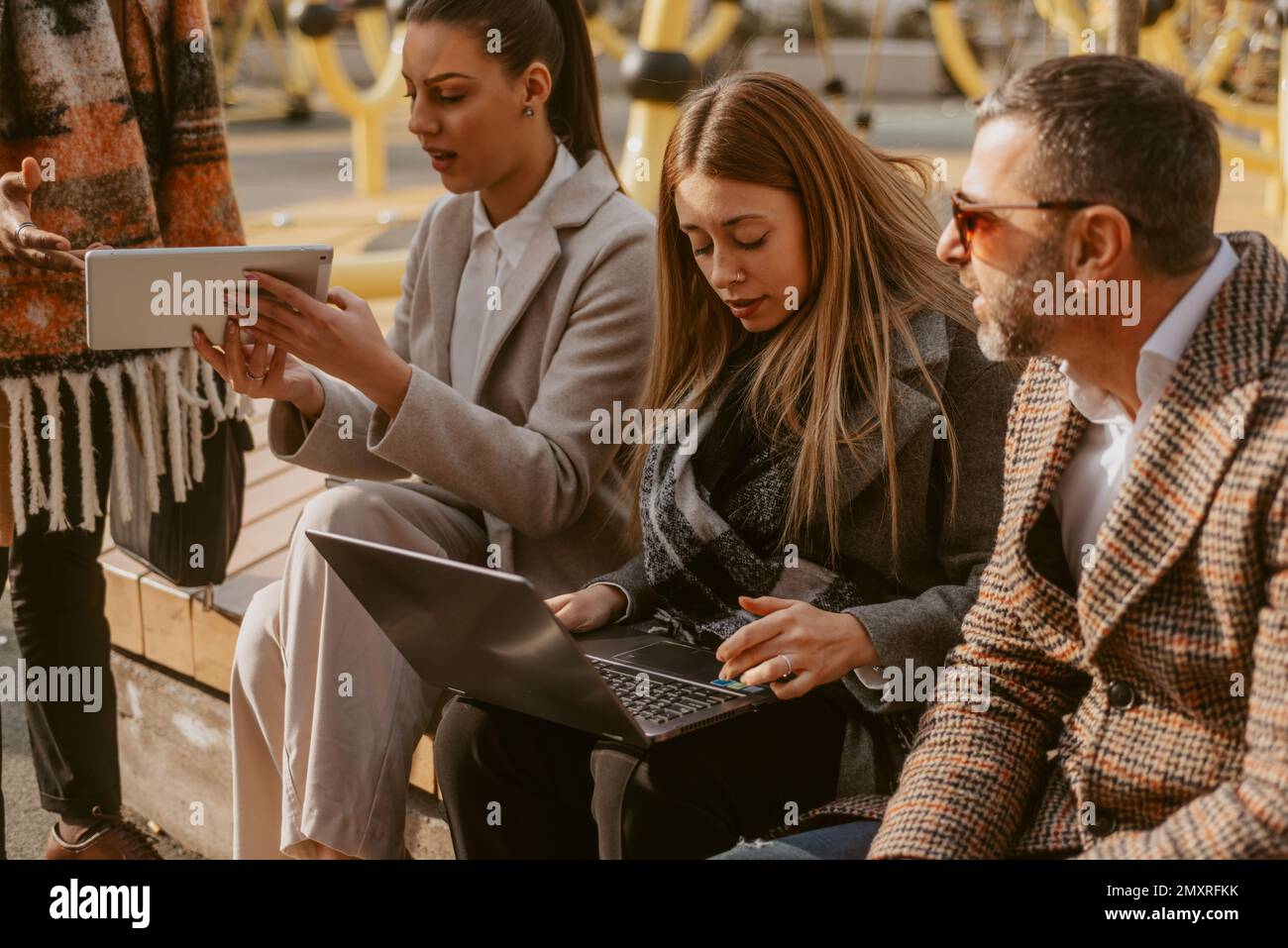 Four smiling successful businessmen sitting hi-res stock photography ...
