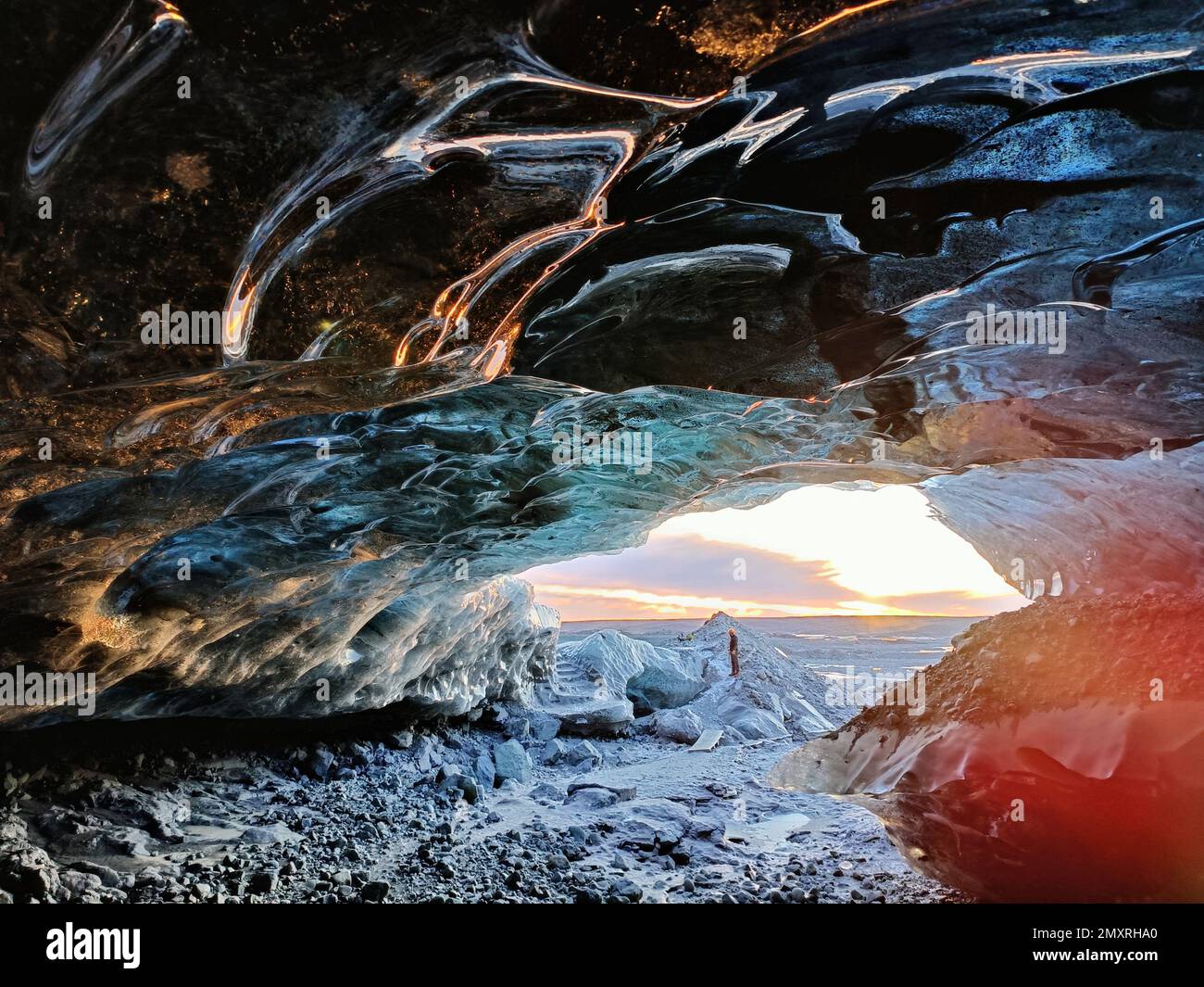 The ice cave of the Katla volcano with the sunset in the background in ...