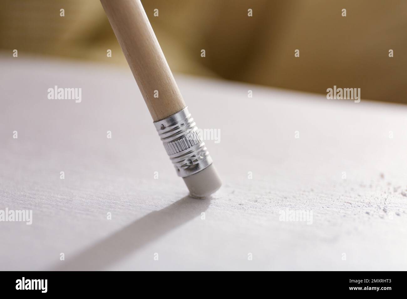 Correcting picture on paper with pencil eraser, closeup view Stock ...