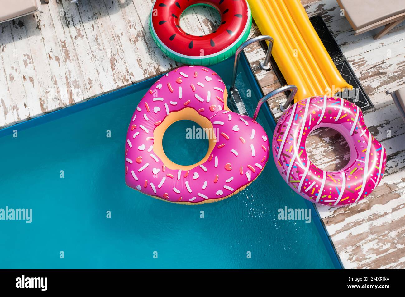 Above view of inflatable rings and swimming pool. Summer vacation Stock ...